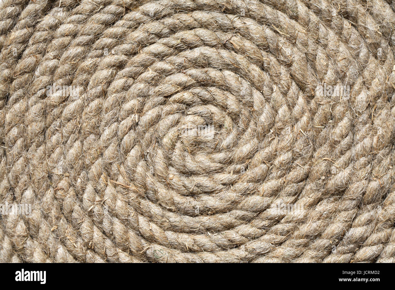 Coil of old hemp rope closeup. Nice background Stock Photo - Alamy