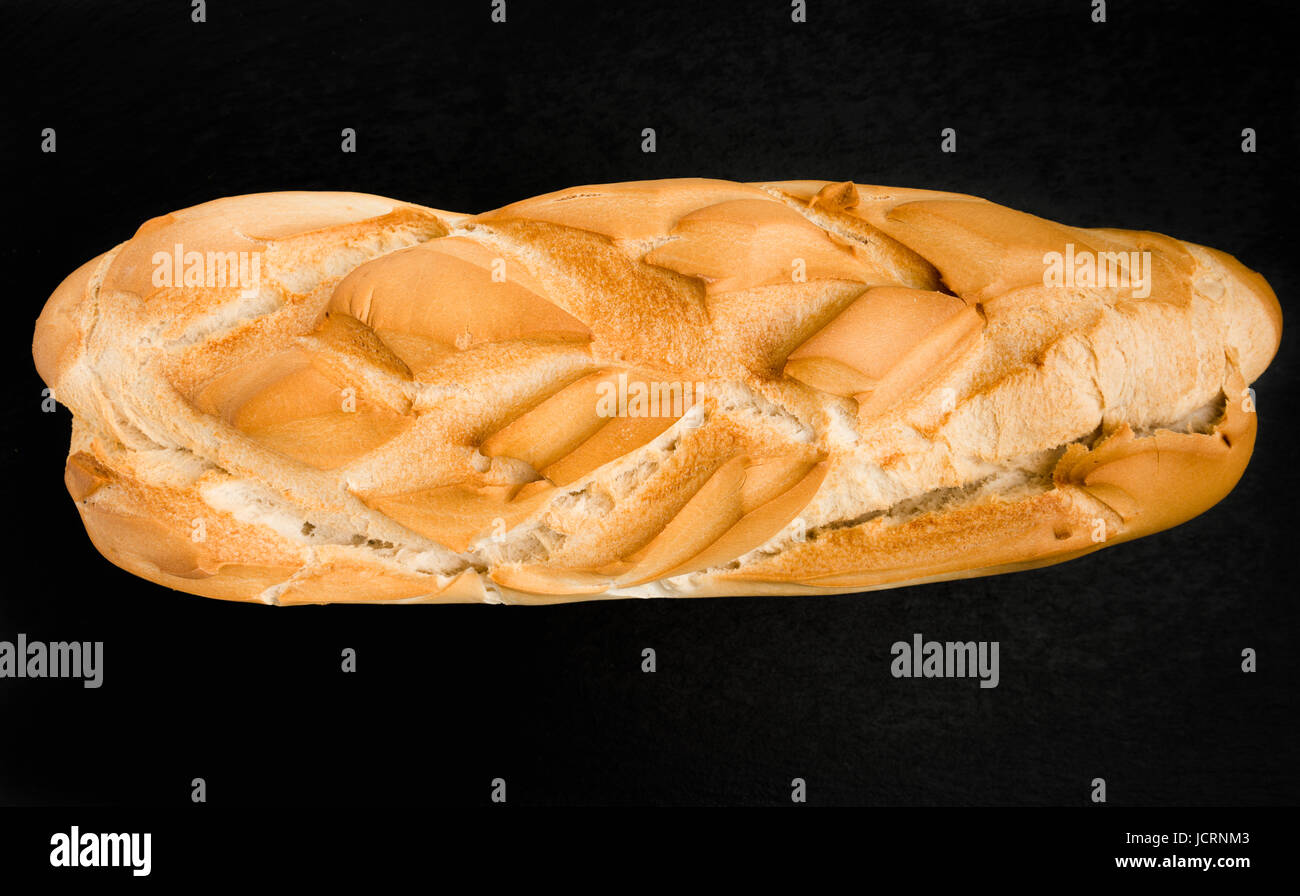 Rustic loaf of bread on tray slate. Top View Stock Photo - Alamy