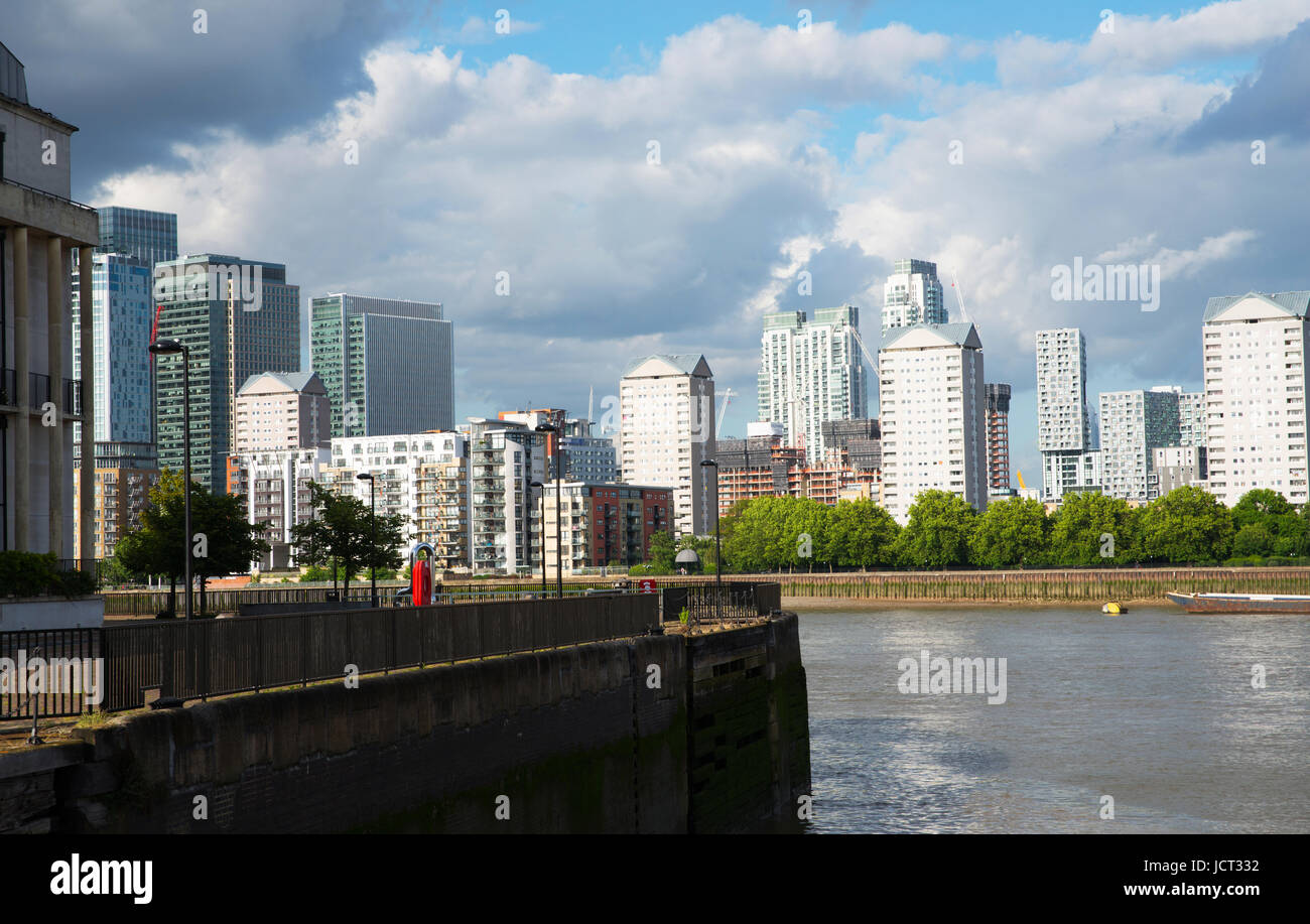 Wide river canal, city skyline, residential buildings on the other side ...