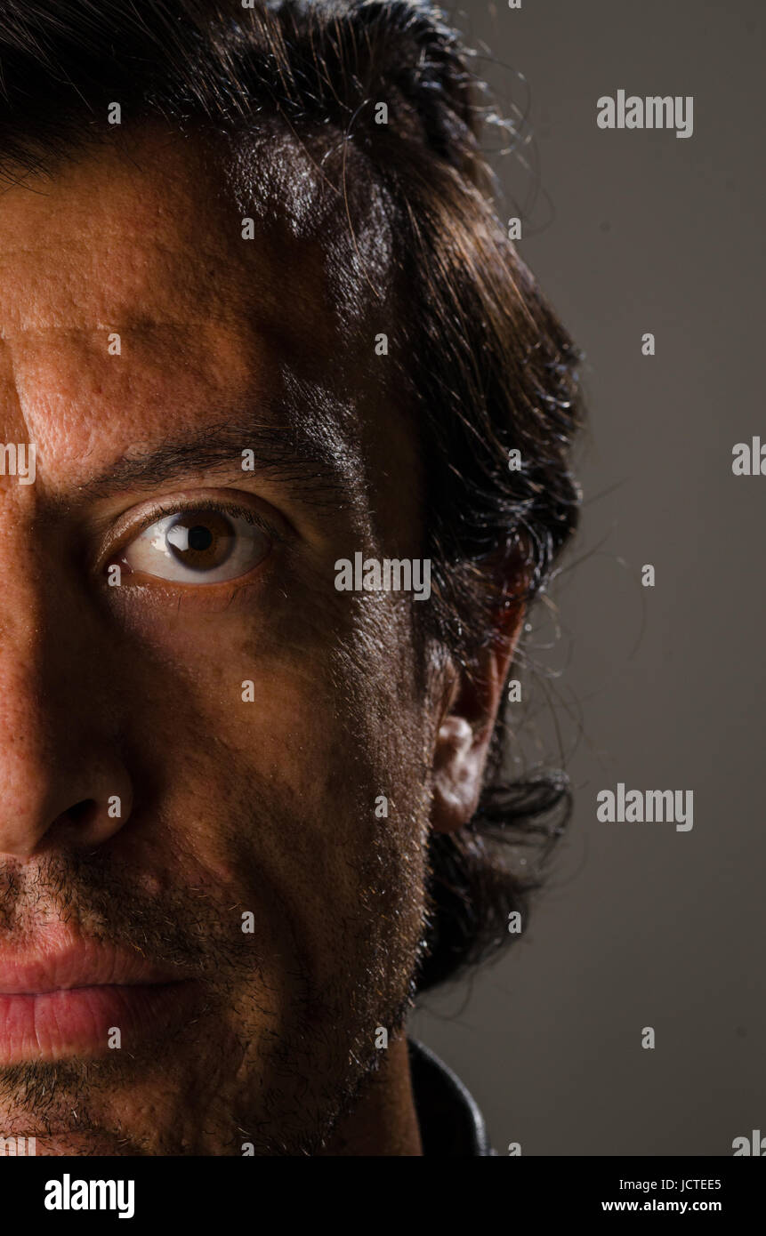 Half face portrait of a hispanic male Stock Photo - Alamy