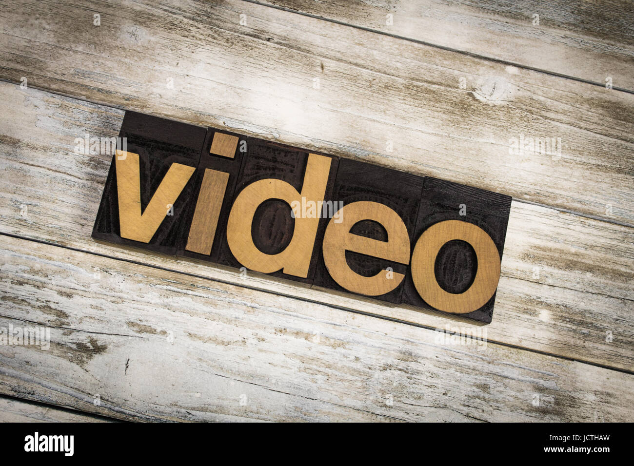 The word "video" written in wooden letterpress type on a white washed ...