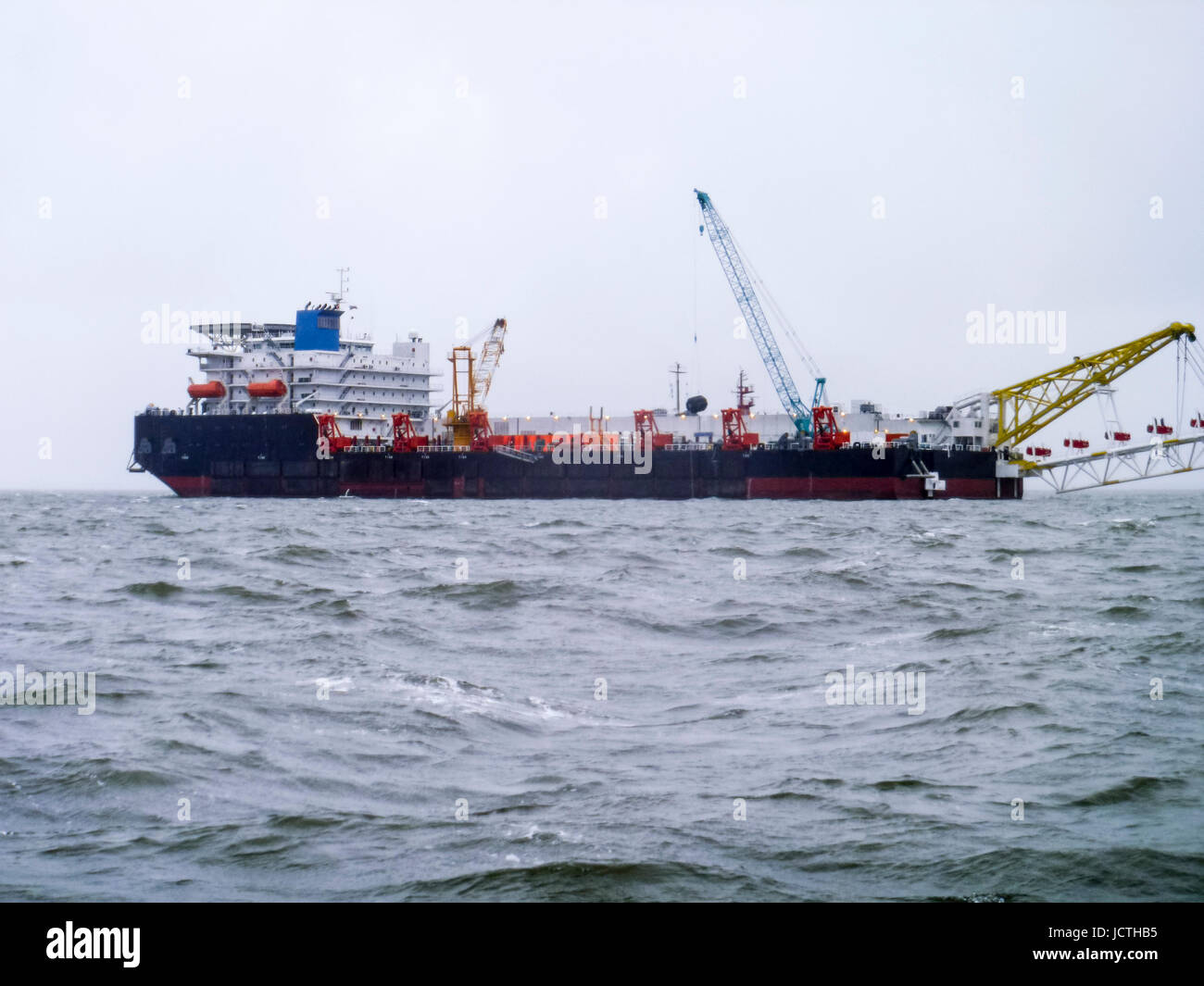 The cargo ship with the crane, the top view. Pipelaying barge Stock ...