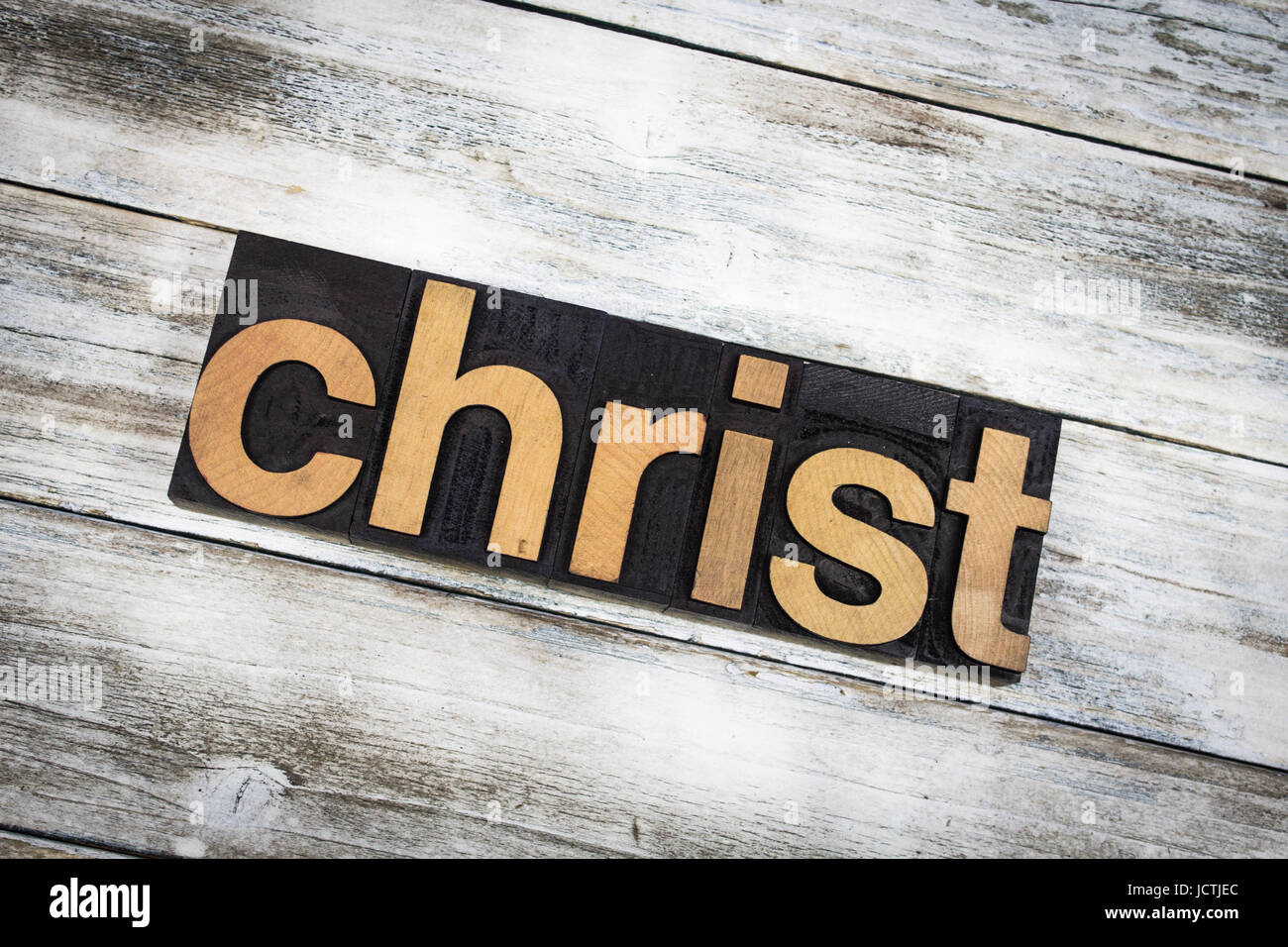 The word "christ" written in wooden letterpress type on a white washed ...