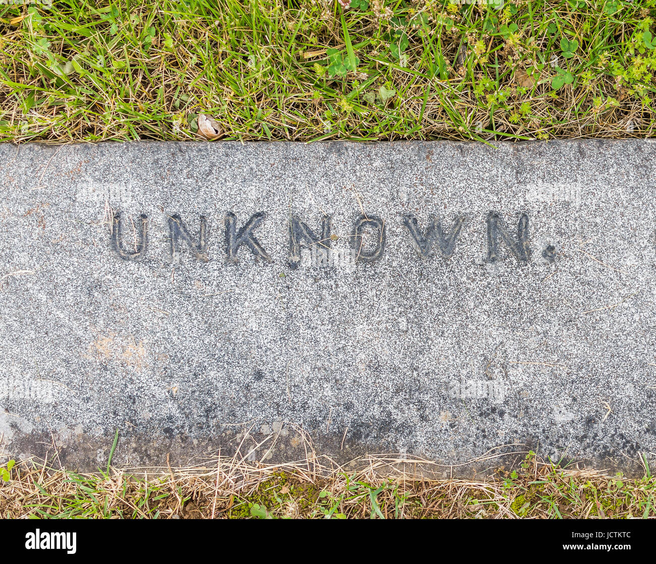 Gettysburg National Cemetery battlefield park with closeup of one grave ...
