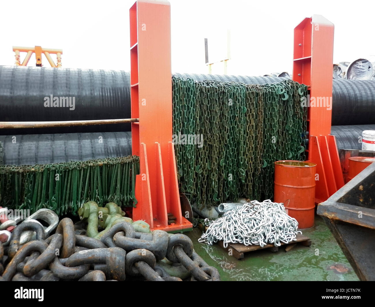 Chains and hooks on the deck of the pipelaying vessel. Rack with ...