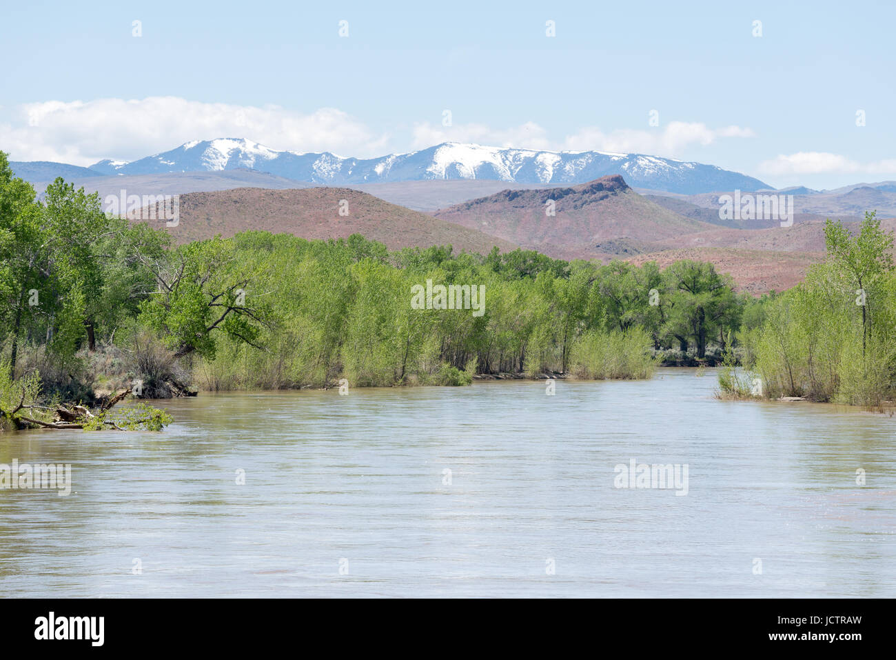 Carson River at high water with the Sierra Range in the background ...