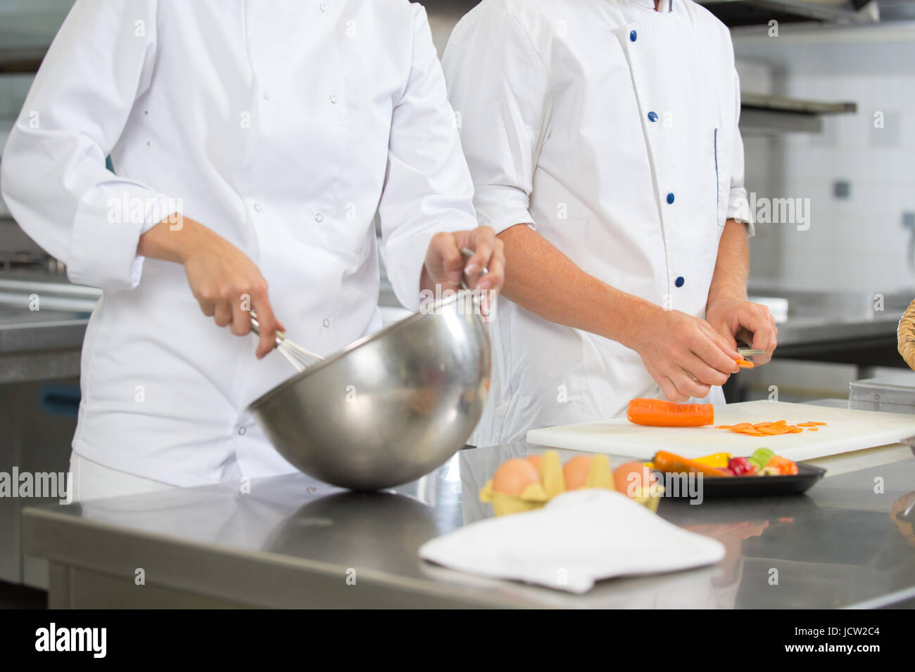 professional chefs cooking in a kitchen Stock Photo - Alamy