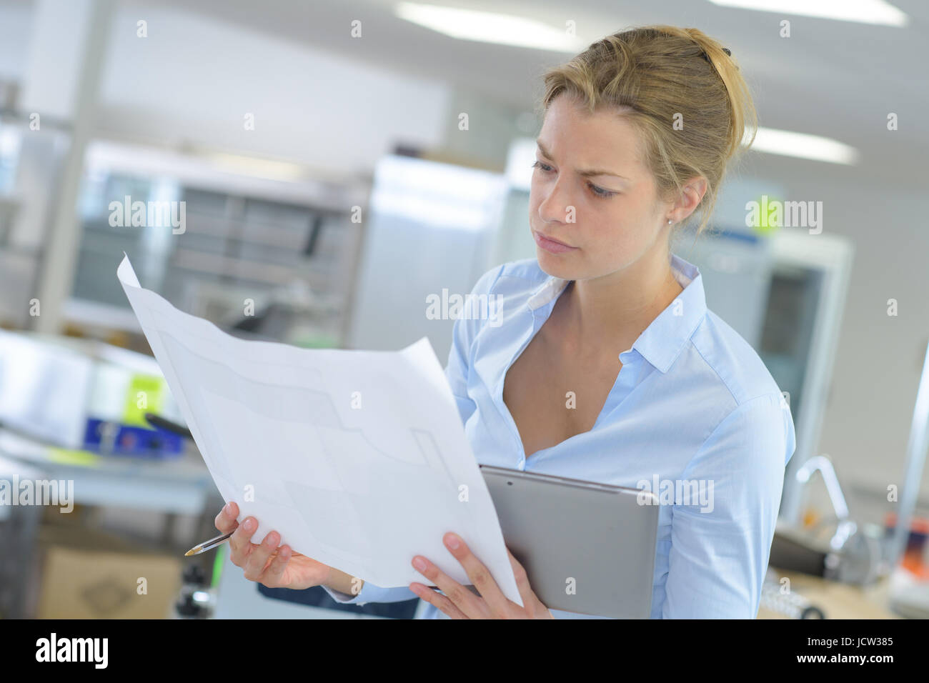 woman reading documents Stock Photo - Alamy