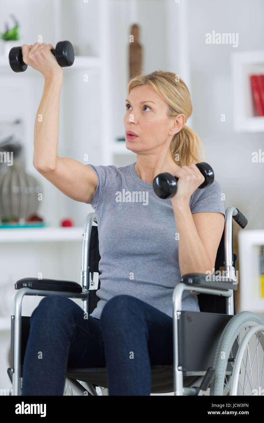 disabled woman exercising at home Stock Photo - Alamy