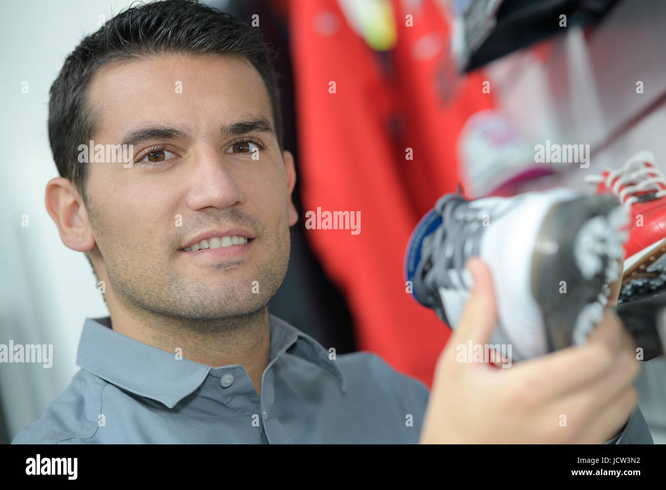 confident worker in a sport shop Stock Photo - Alamy