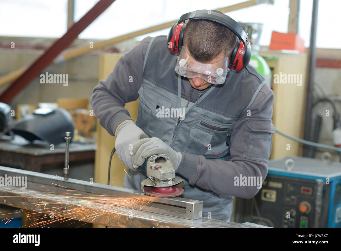 industrial worker cutting metal Stock Photo - Alamy