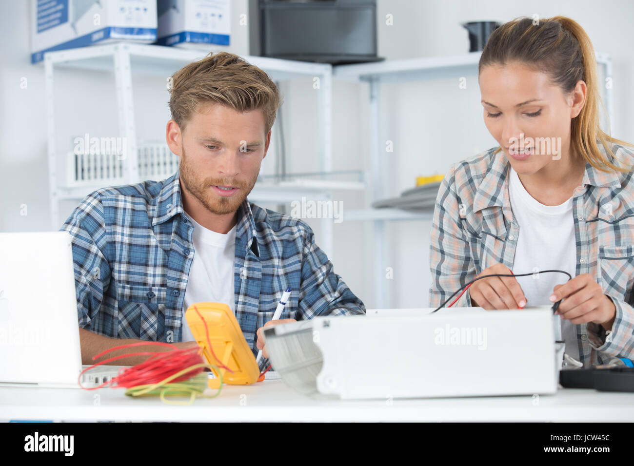 technician and assistant fixing computer hardware Stock Photo - Alamy