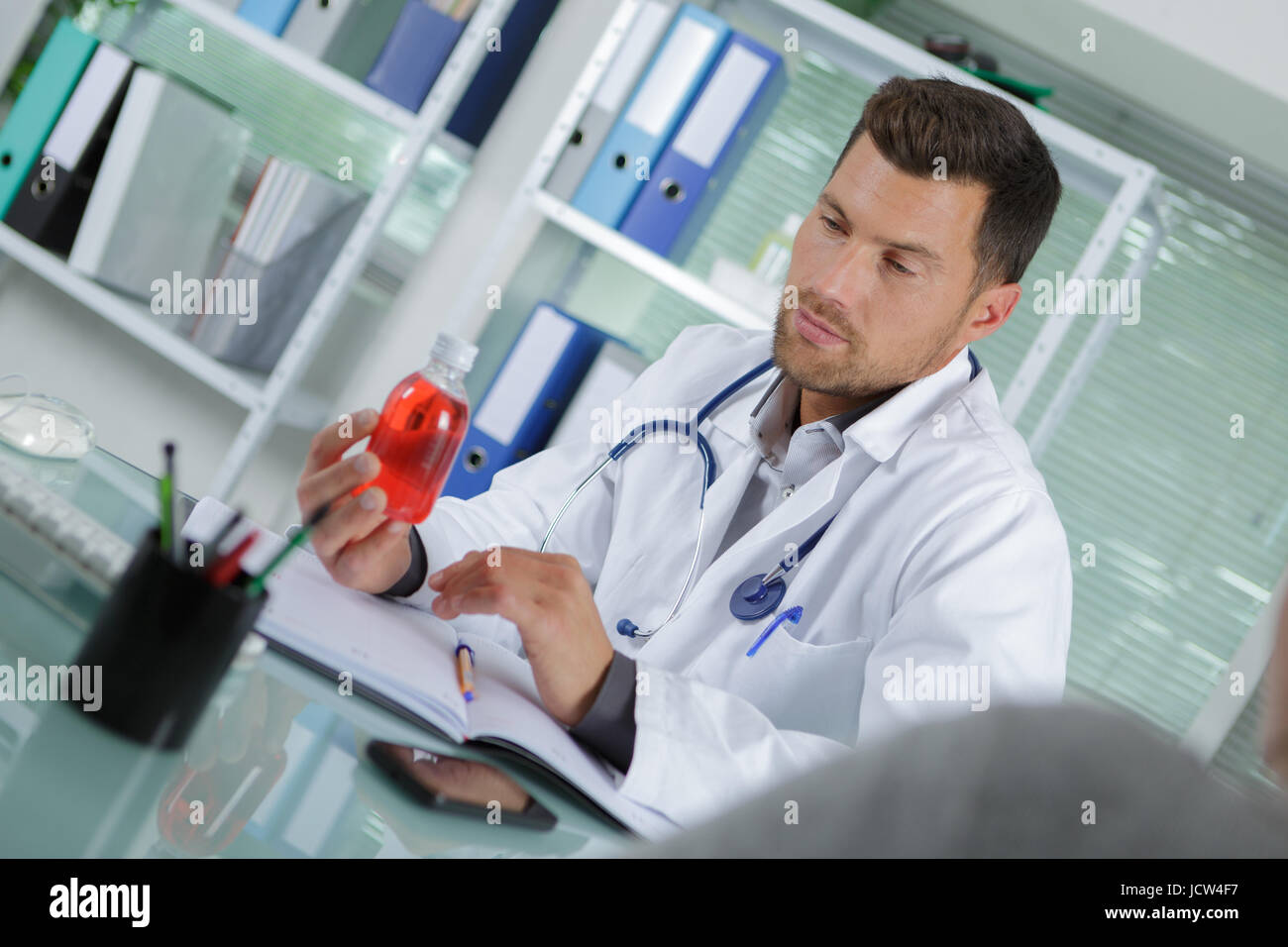 doctor checking medicine Stock Photo - Alamy