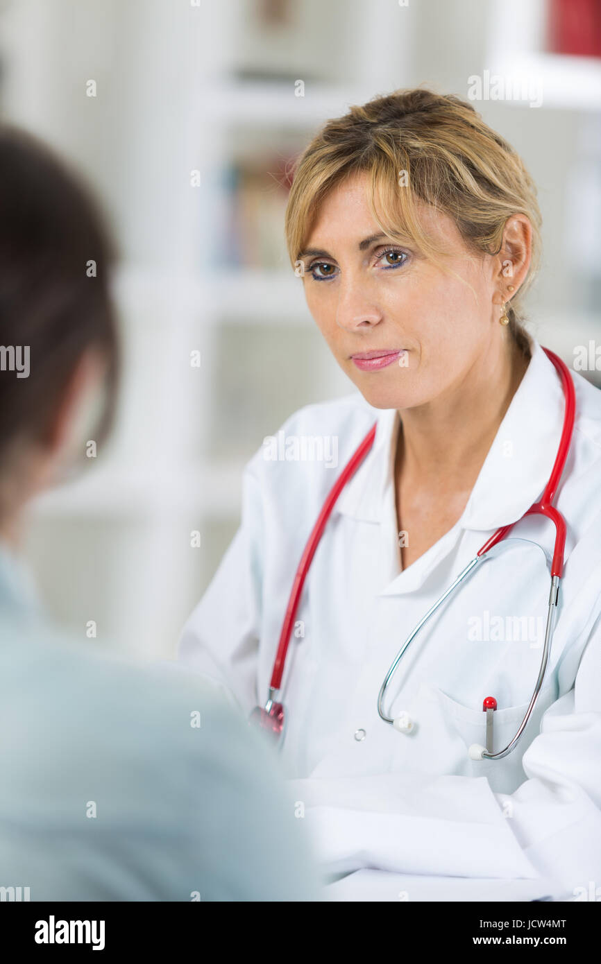 doctor listening to his patient Stock Photo - Alamy