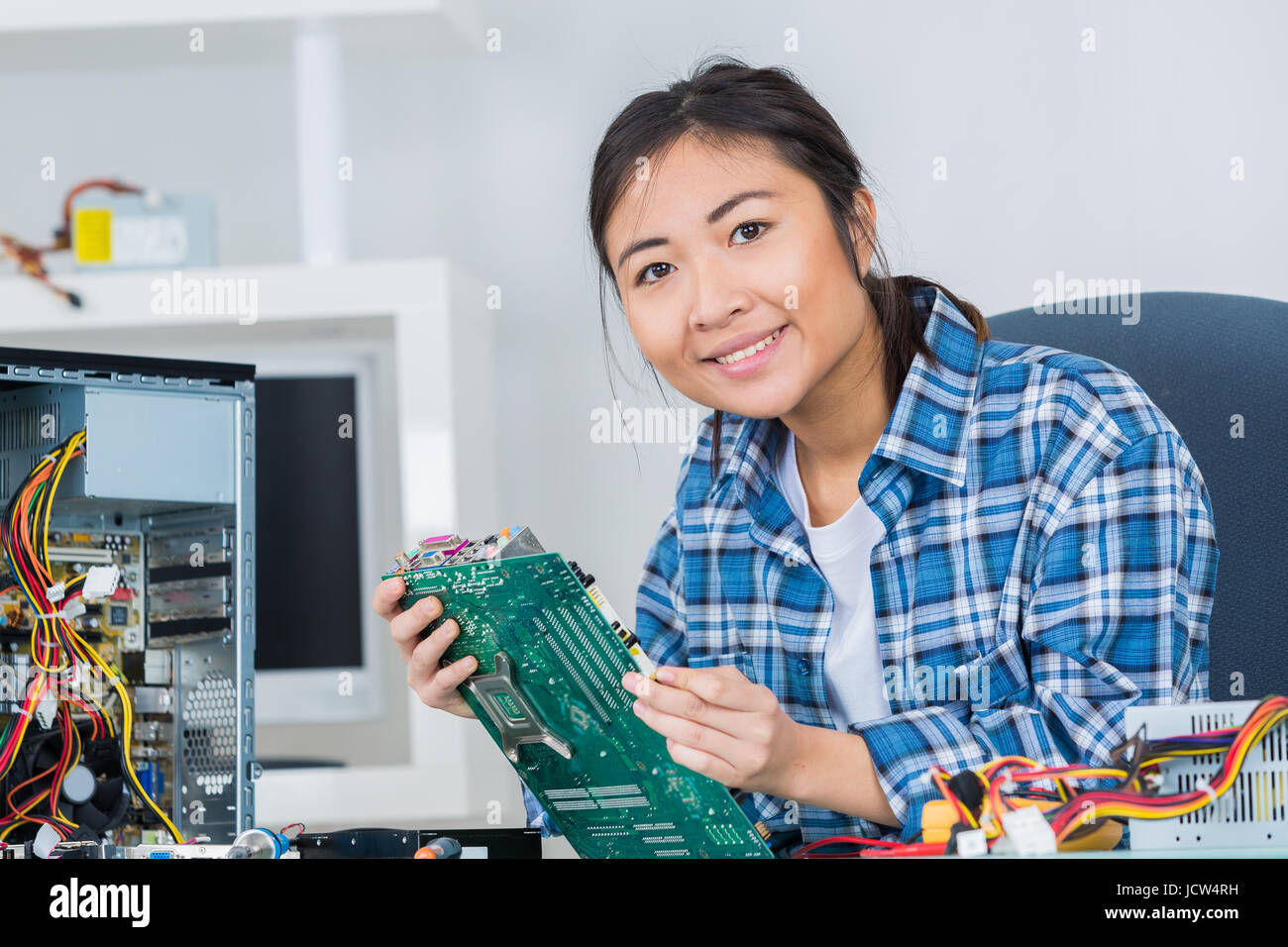 woman fixing a computer hard drive Stock Photo - Alamy