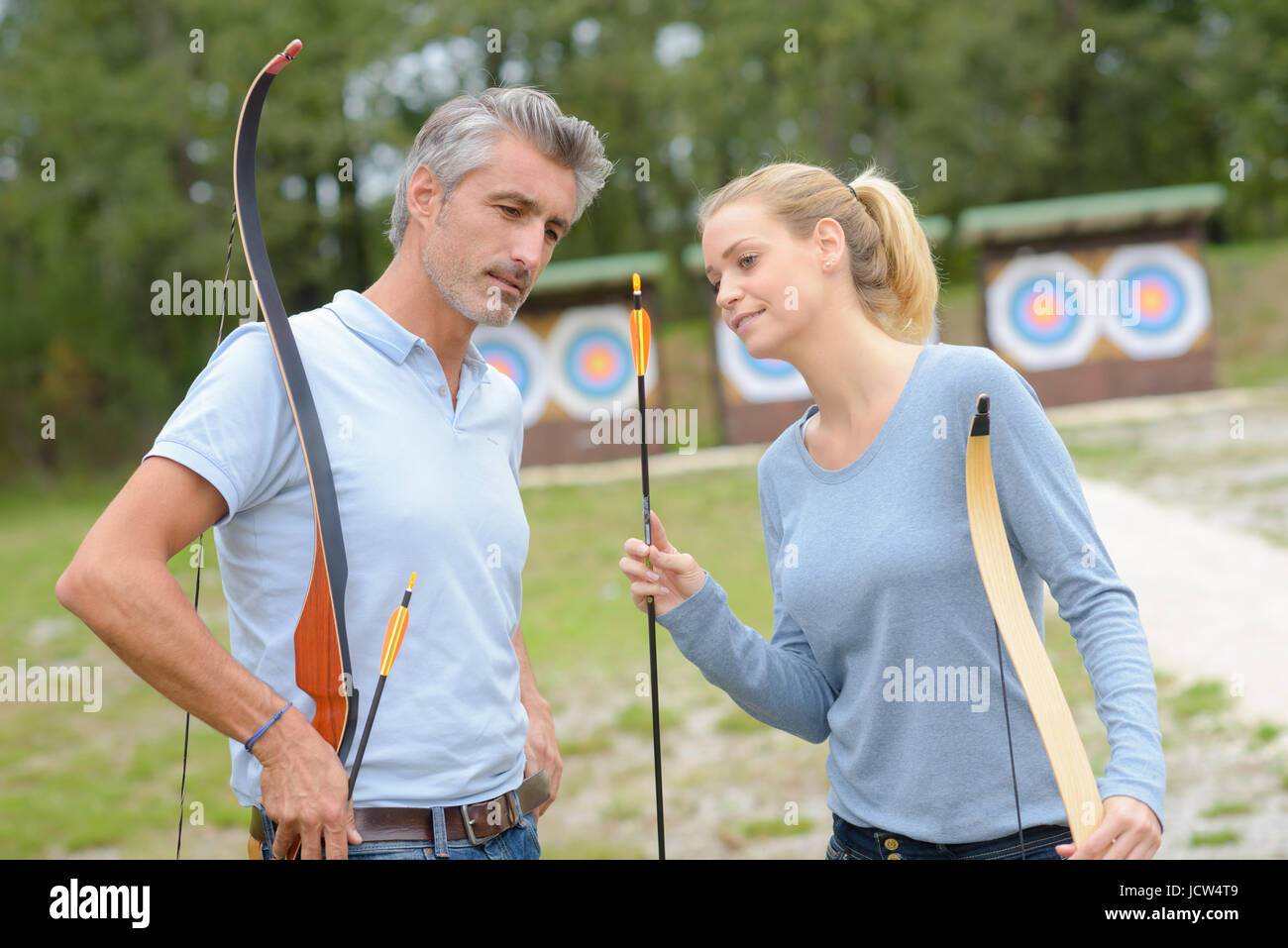 archery couple practicing together Stock Photo - Alamy