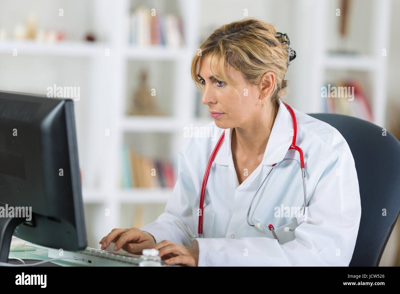 Doctor using computer Stock Photo - Alamy