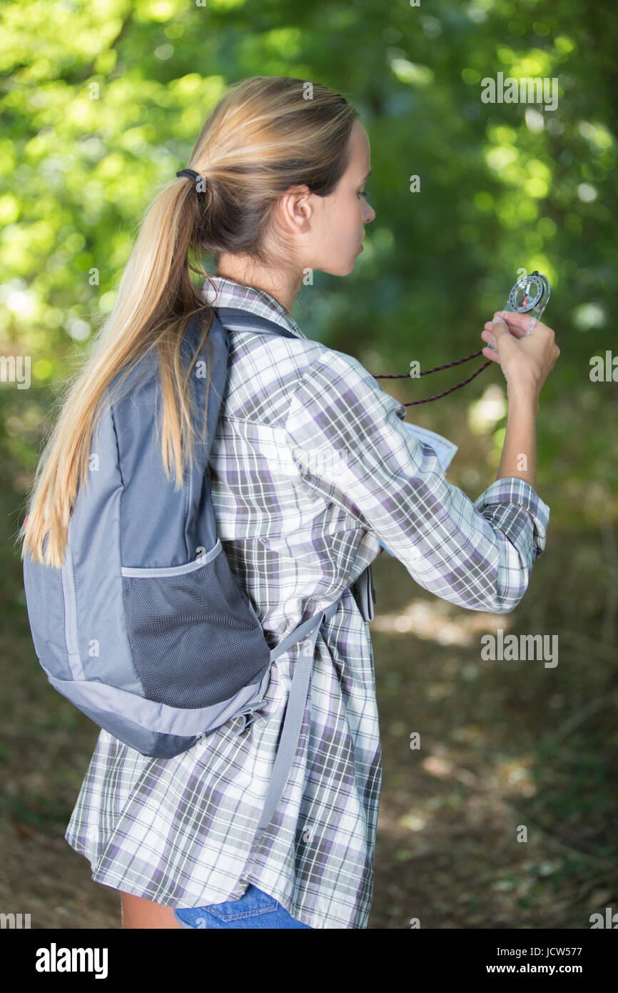 woman on forestwith compass Stock Photo - Alamy