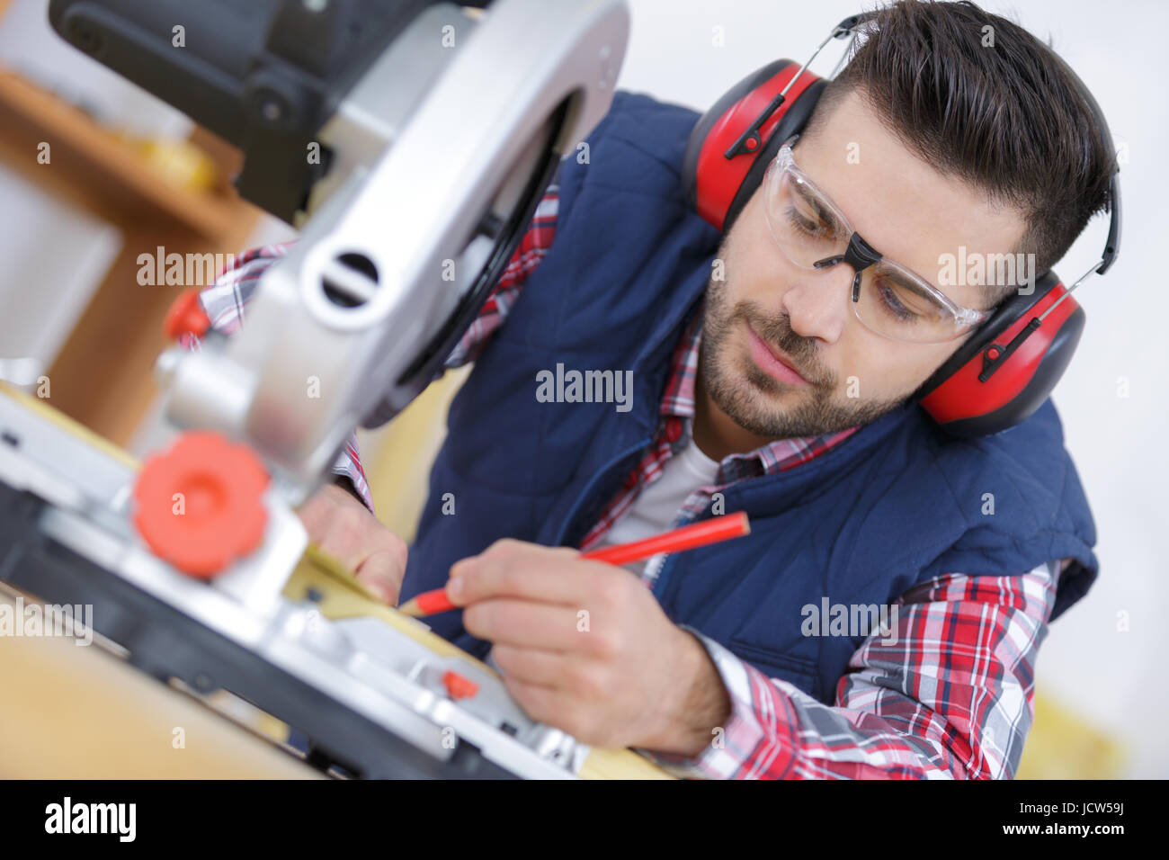 drawing man before using a circular saw Stock Photo - Alamy
