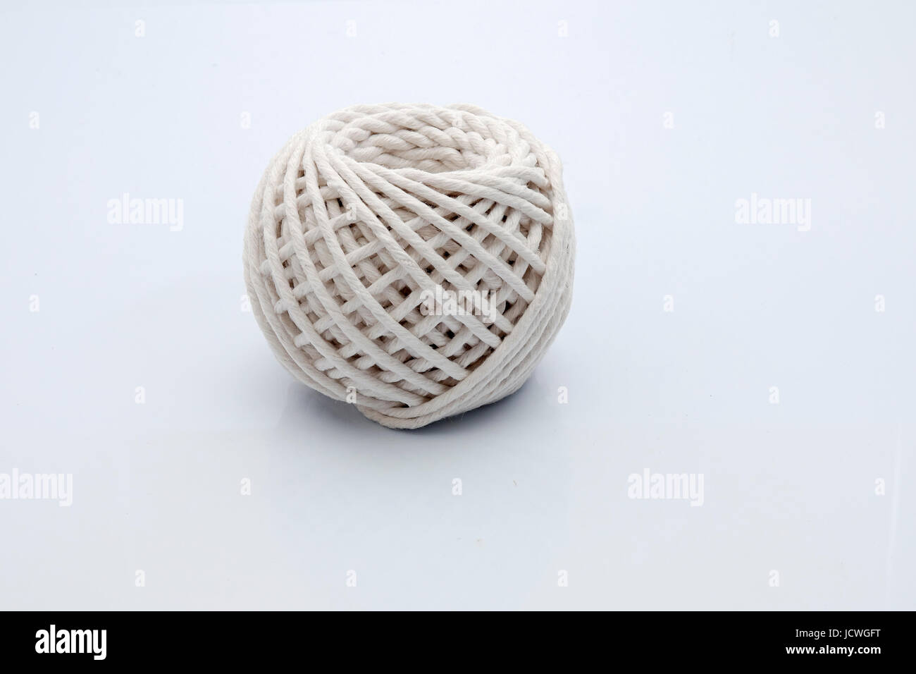 Thread spool isolated on white Stock Photo - Alamy