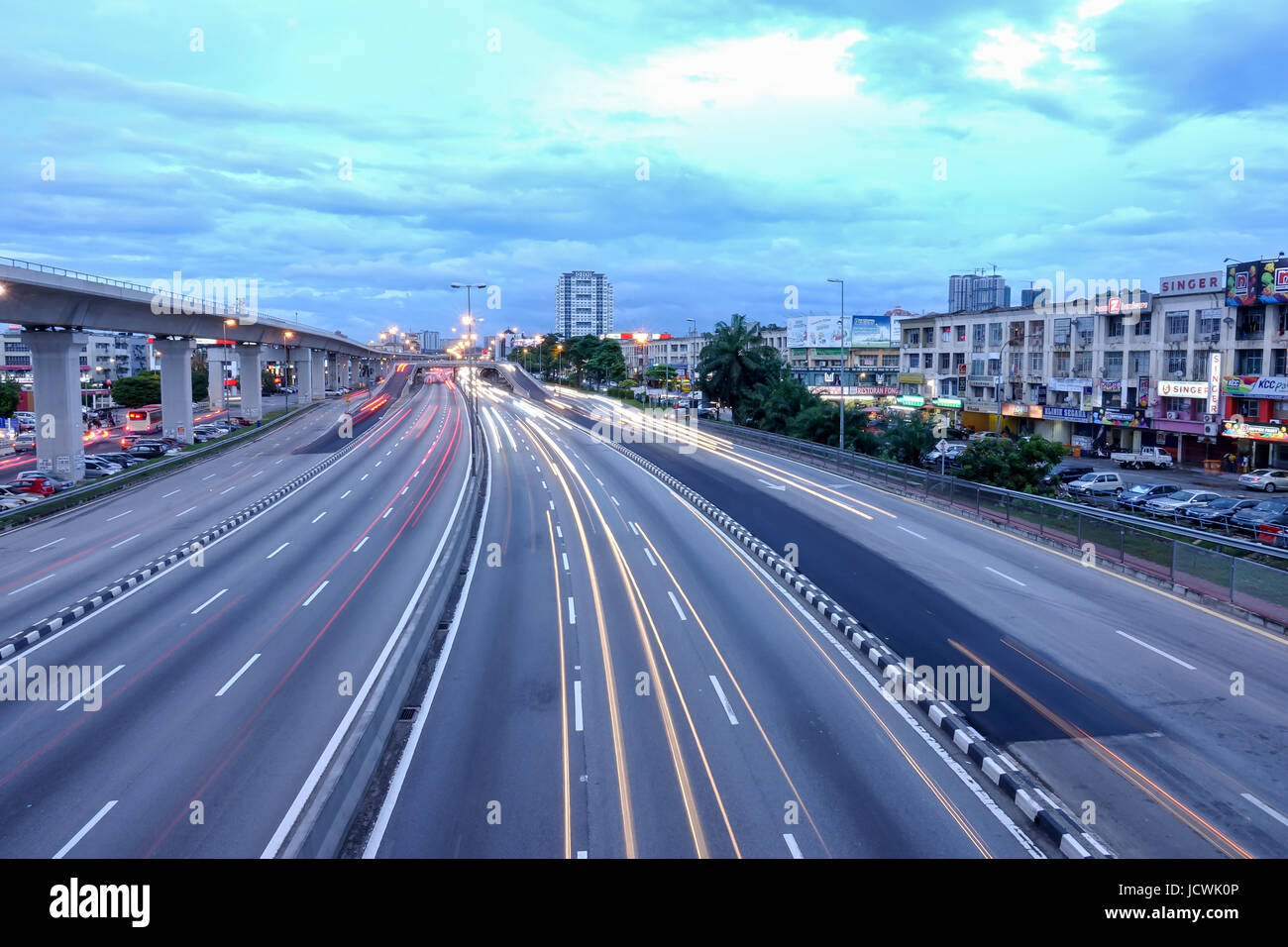 KUALA LUMPUR, 22 JANUARY 2017. light trails on highway at sundown time ...