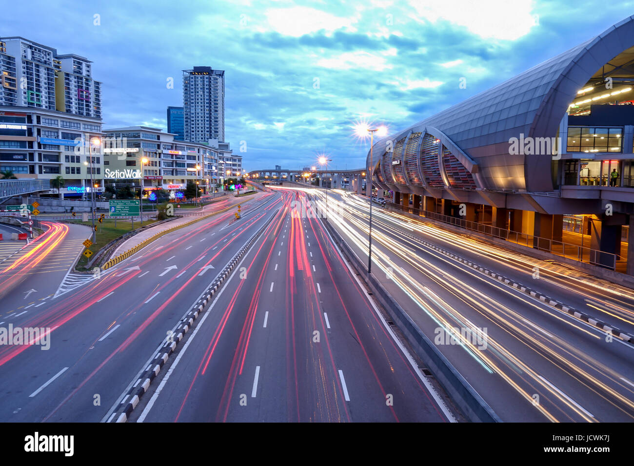 KUALA LUMPUR, 22 JANUARY 2017. light trails on highway at sundown time ...