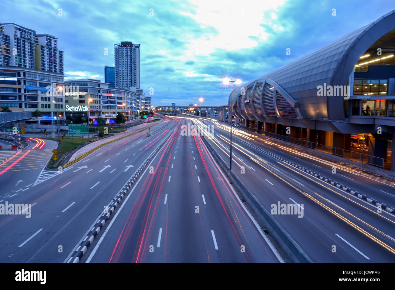 KUALA LUMPUR, 22 JANUARY 2017. light trails on highway at sundown time ...