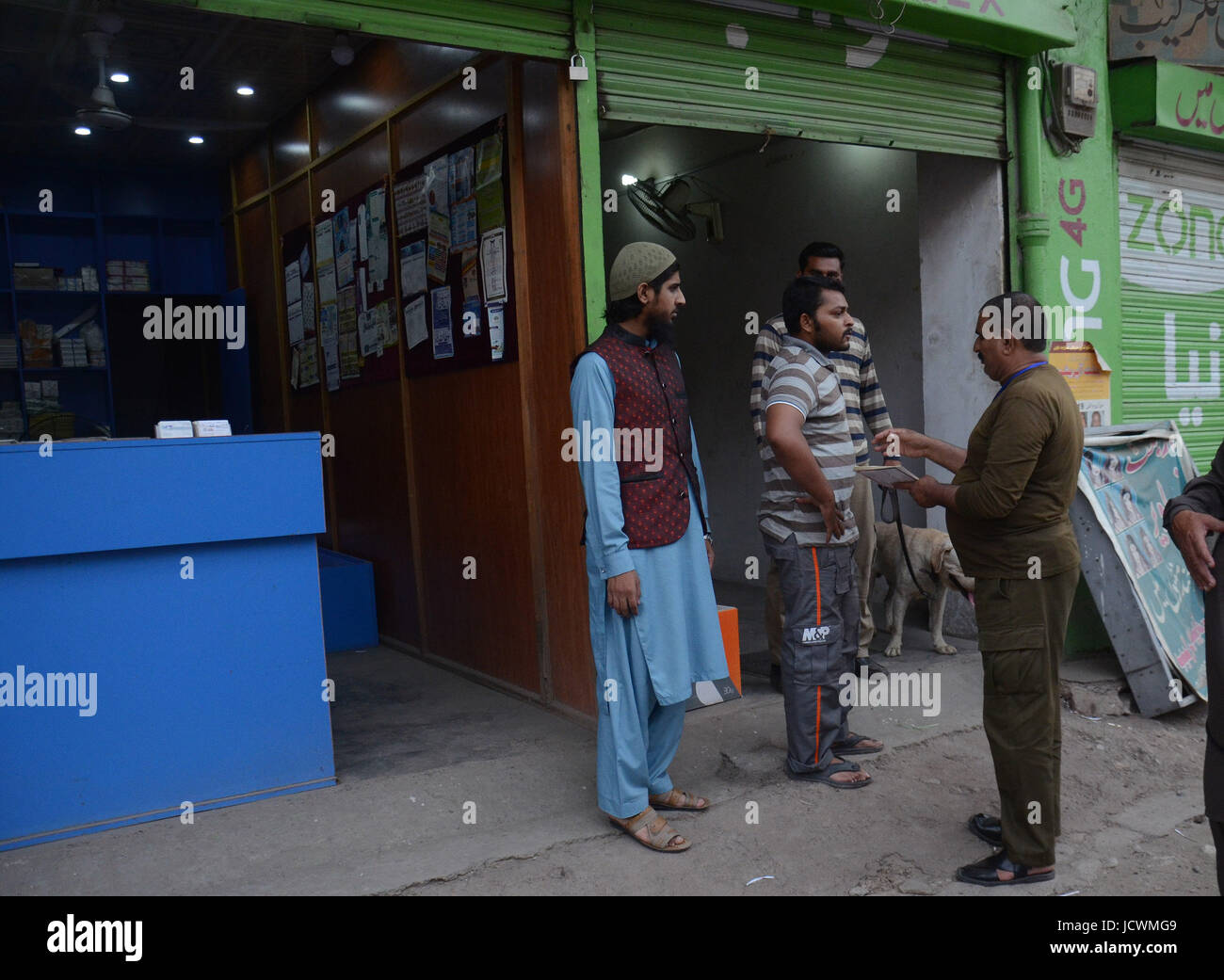 Lahore, Pakistan. 17th June, 2017. Pakistani security personnel busy in ...