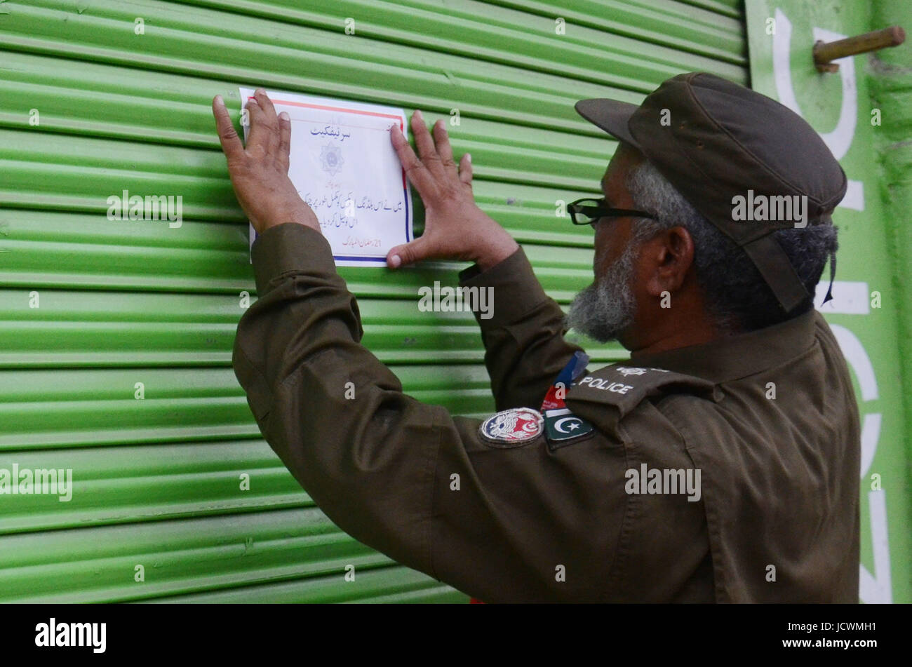 Lahore, Pakistan. 17th June, 2017. Pakistani security personnel busy in ...