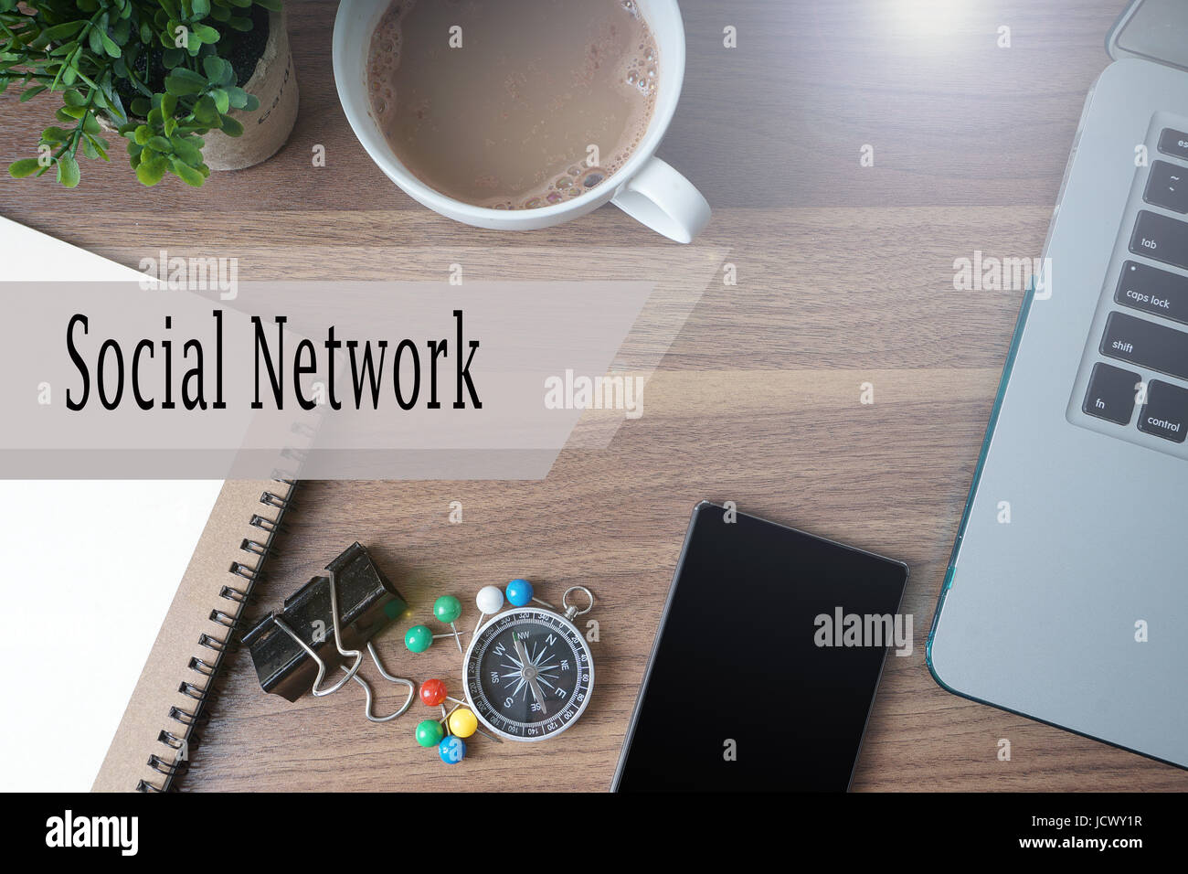 Top view of laptop,notes,smartphone,compass and clips with business and ...