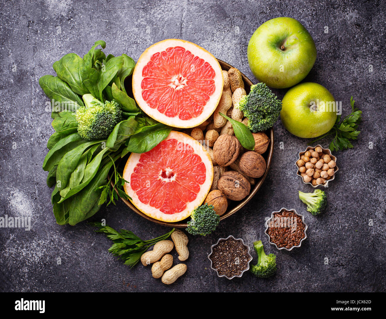 Healthy vegetarian food. Vegetables, fruit, seeds and nuts. Selective ...