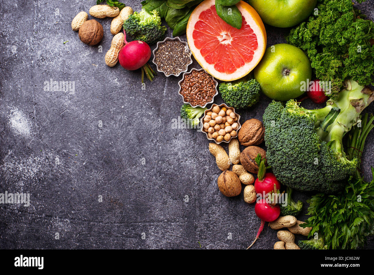 Healthy vegetarian food. Vegetables, fruit, seeds and nuts. Selective ...