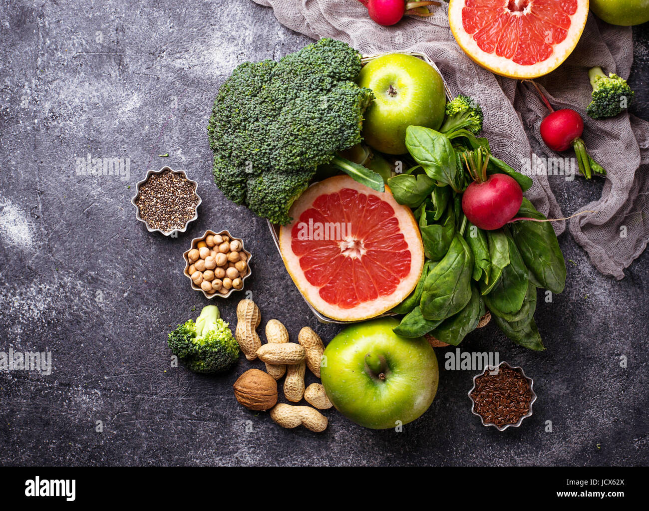 Healthy vegetarian food. Vegetables, fruit, seeds and nuts. Selective ...