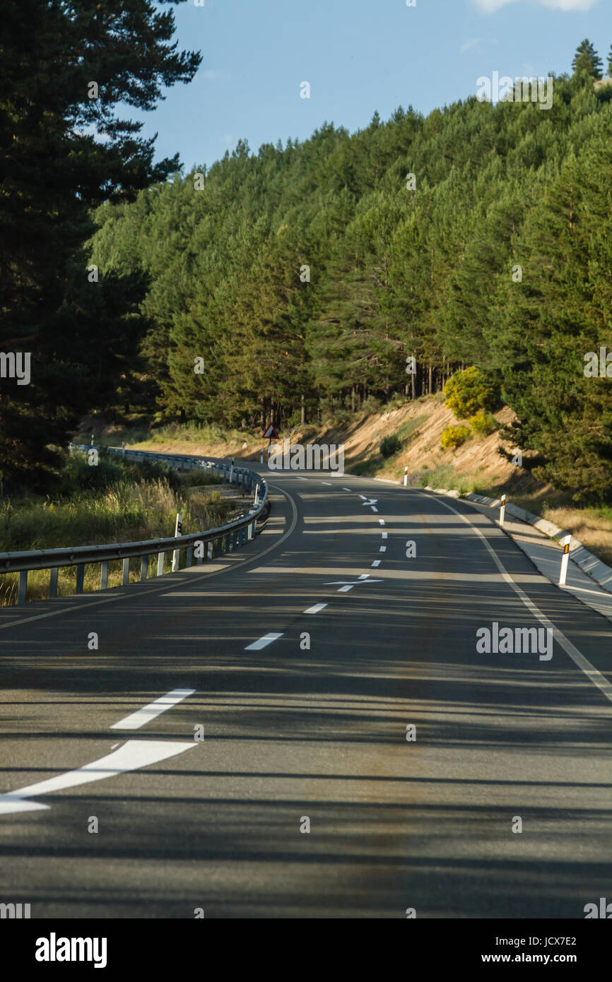 a winding road, protections and warning signs Stock Photo - Alamy