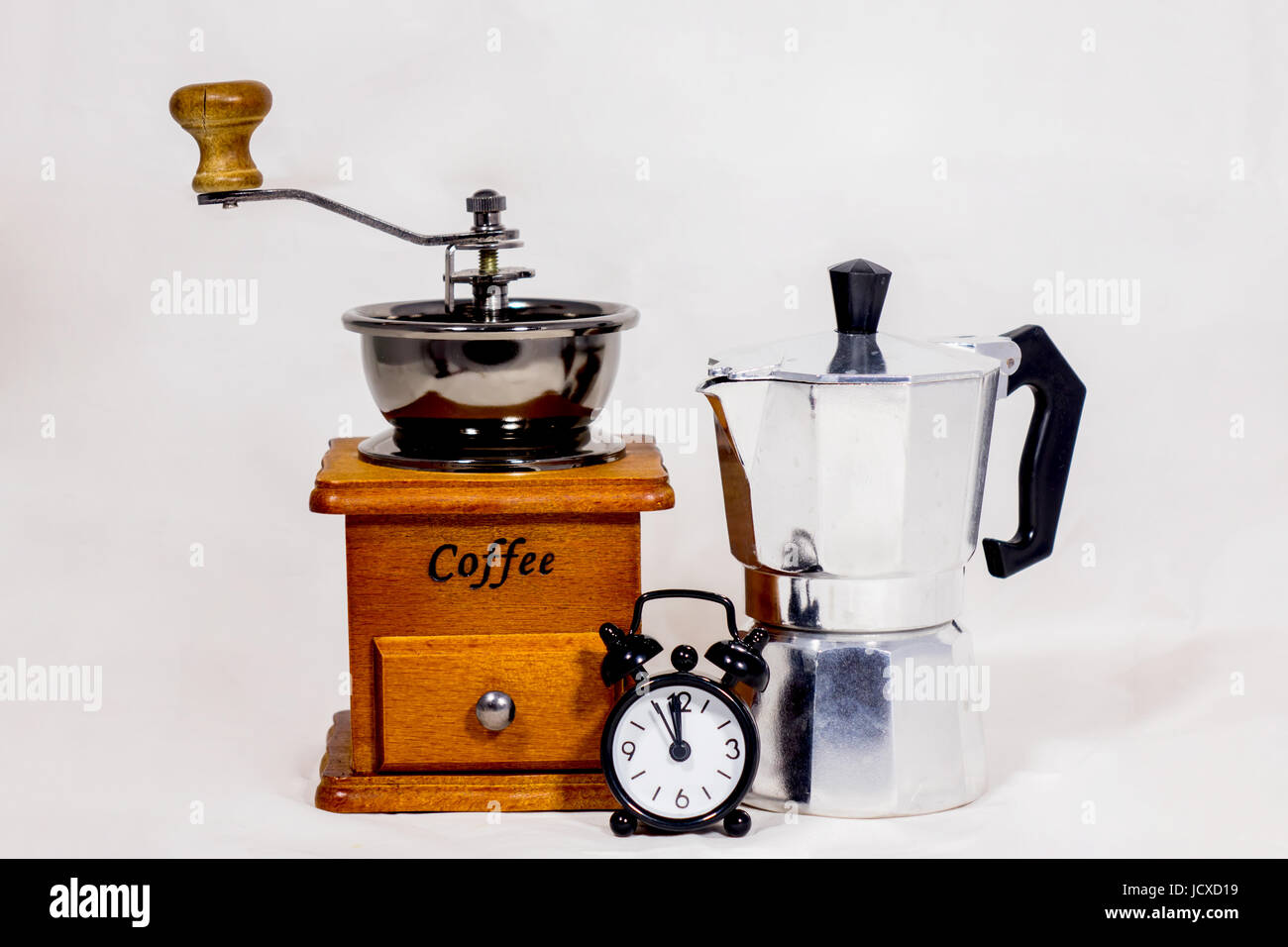 Alarm clock, coffee grinder and boiler, vintage on white background ...