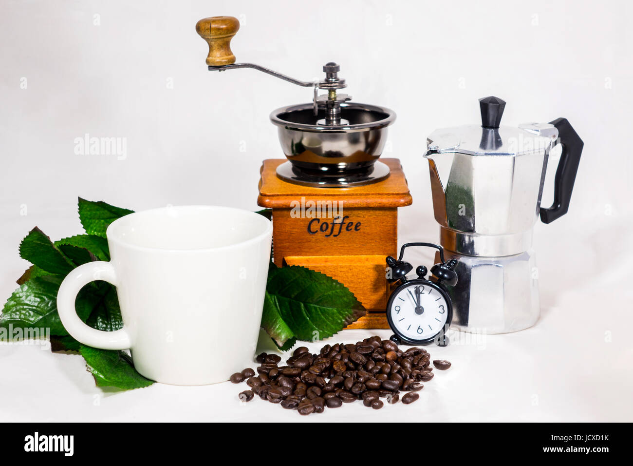 Coffee cup, alarm clock, coffee grinder and boiler, vintage on white ...