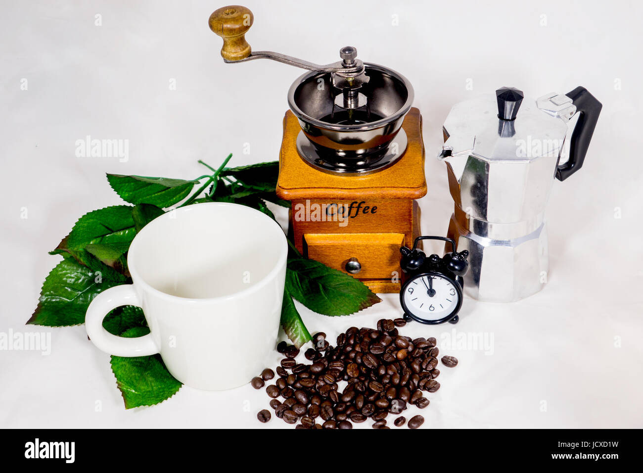 Coffee cup, alarm clock, coffee grinder and boiler, vintage on white ...