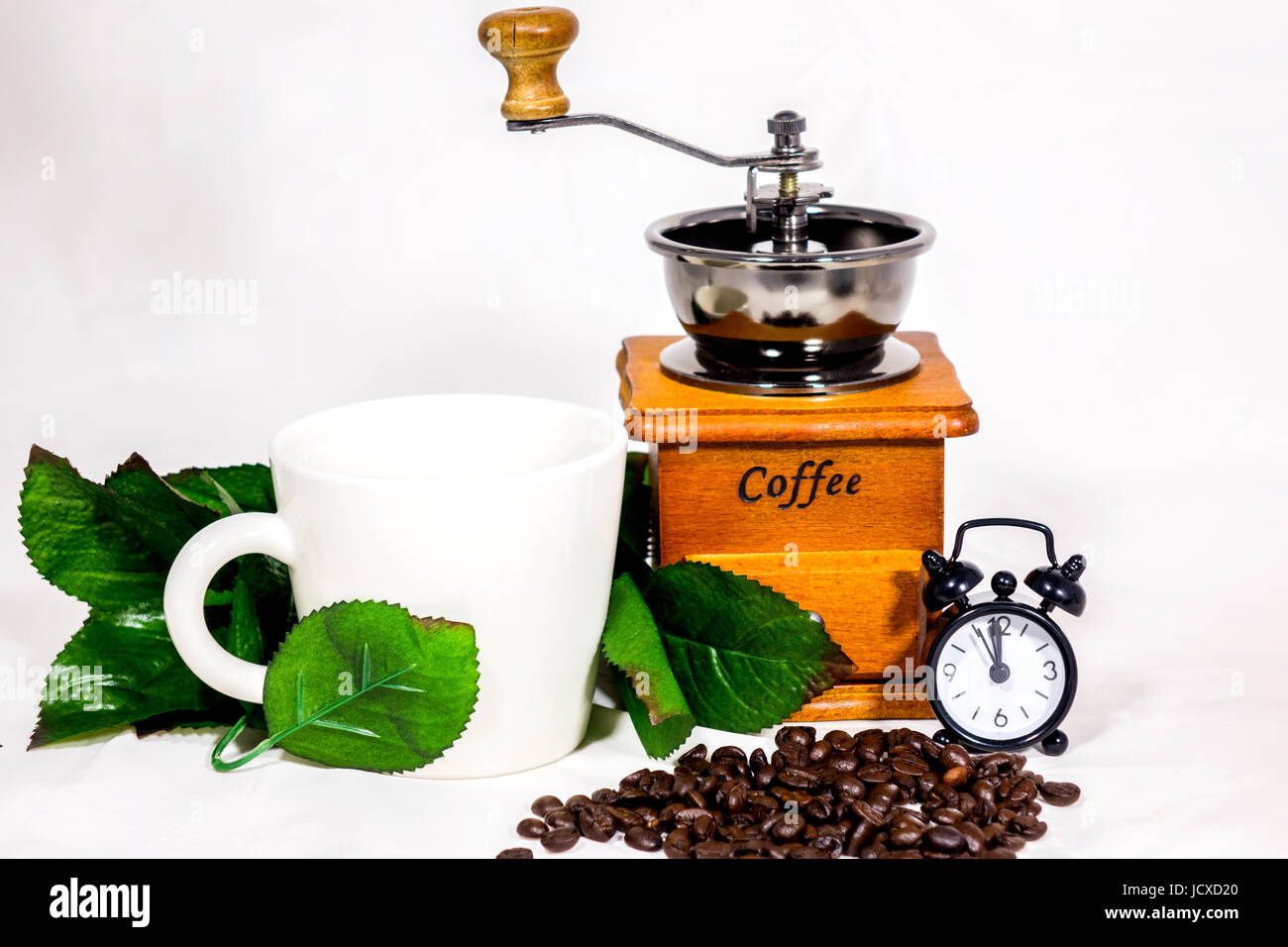 Coffee cup, alarm clock, coffee grinder vintage on white background ...