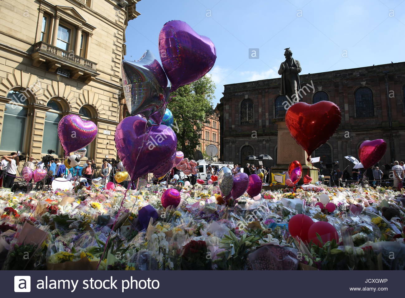 A floral tribute to the victims of the Manchester bombing, viewed by ...