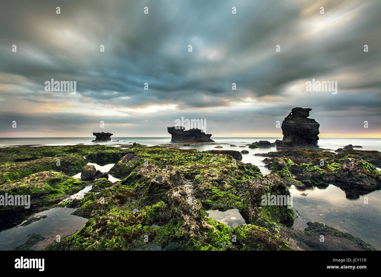 Haunting long exposure seascape photo with dramatic sky and unique sea ...
