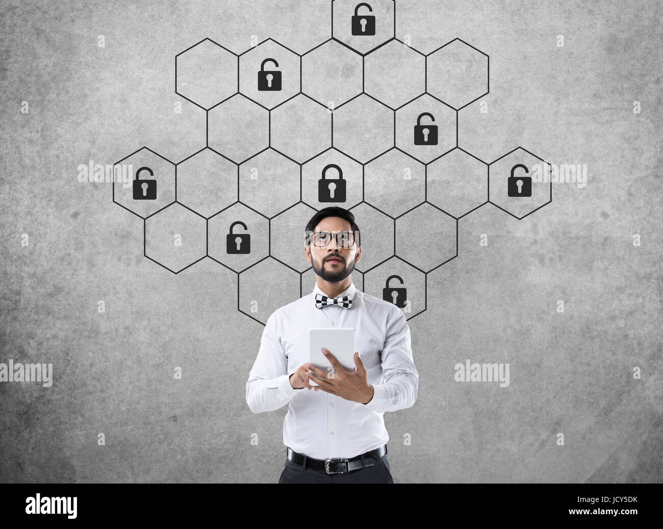 Thoughtful businessman with hexagonal lock security concept Stock Photo ...