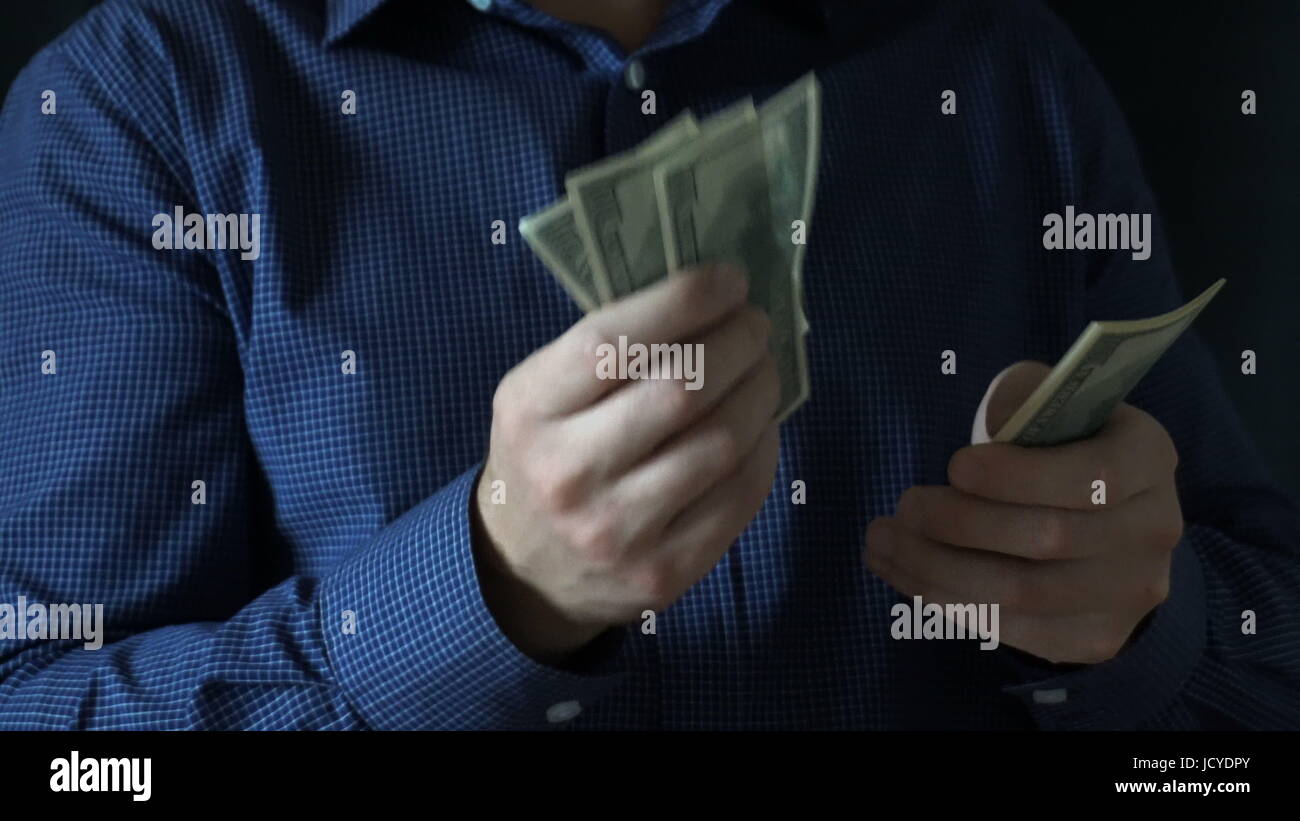 young business man counts hundred dollar bills Stock Photo - Alamy