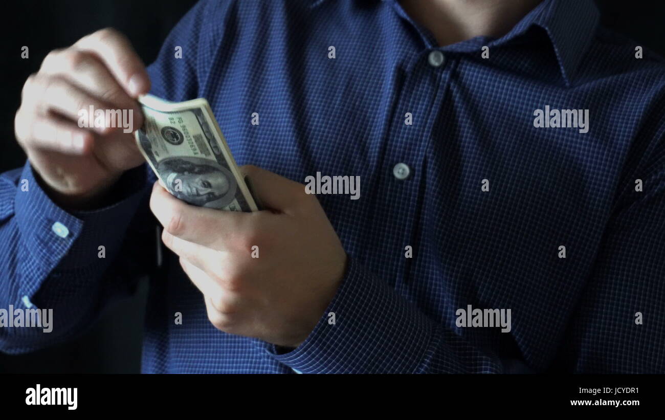 American dollar counts man holding hi-res stock photography and images - Alamy