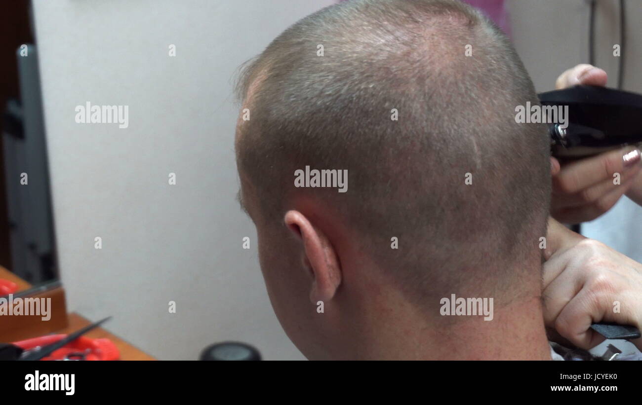 beauty, hairstyle and people concept - man and stylist or hairdresser ...