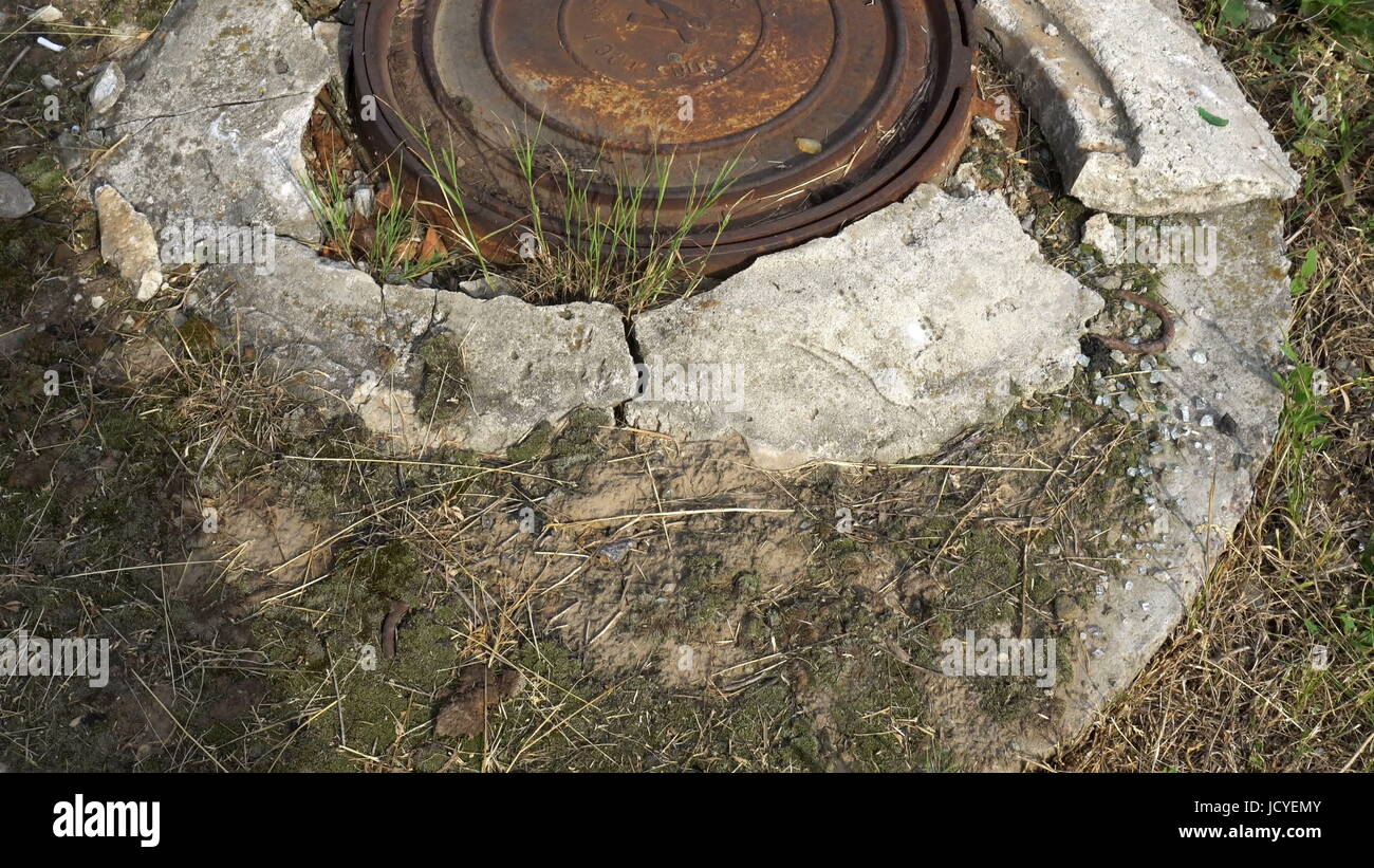 old manhole , rusted and broken Stock Photo - Alamy