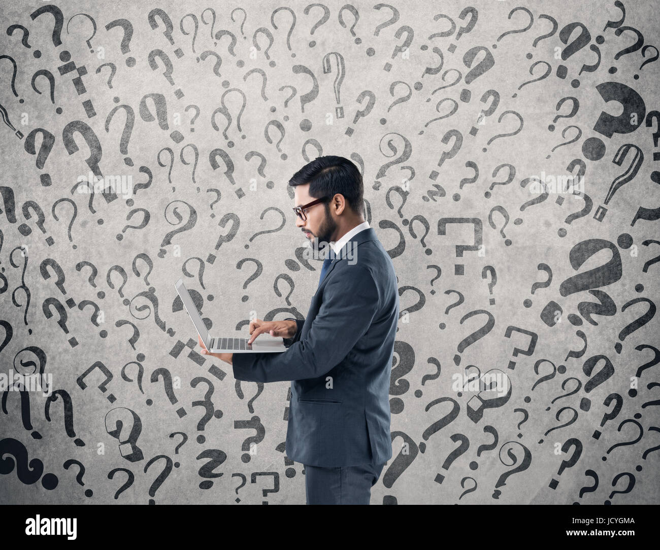 Businessman trying to solve the problems Stock Photo - Alamy