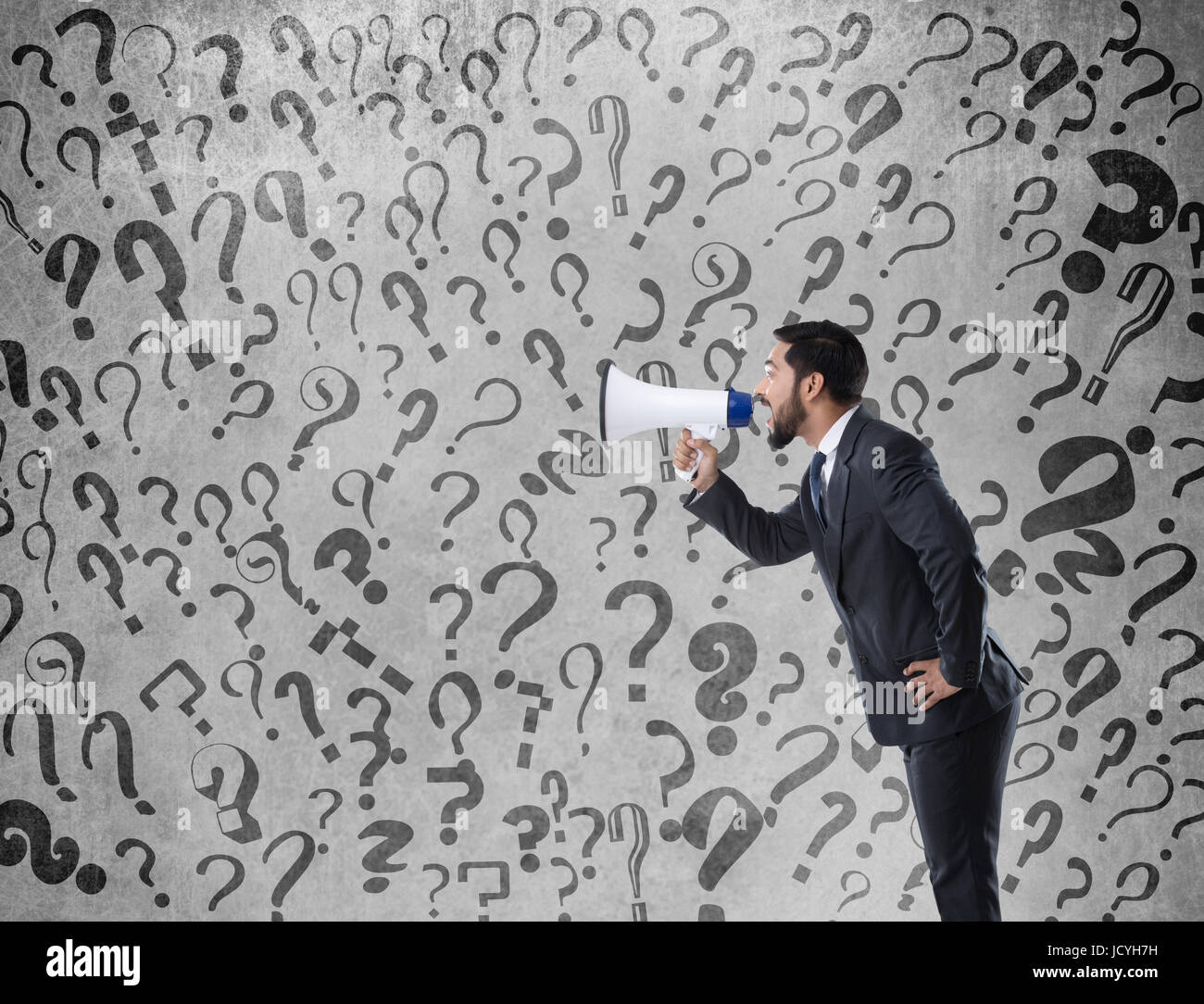 Businessman shouting on megaphone Stock Photo - Alamy