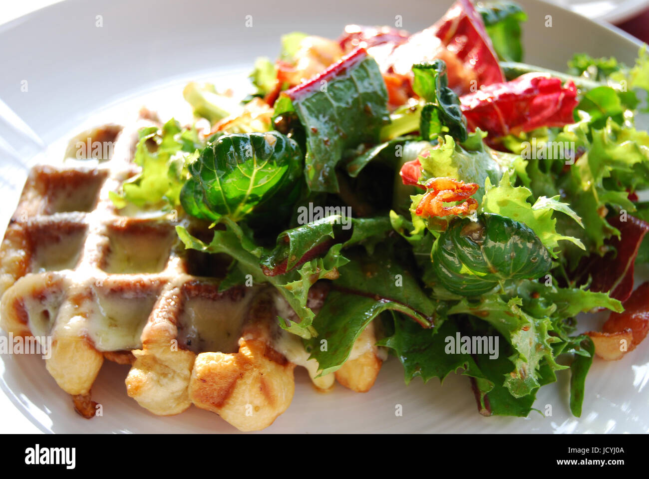 Sweet waffle and salad Stock Photo - Alamy
