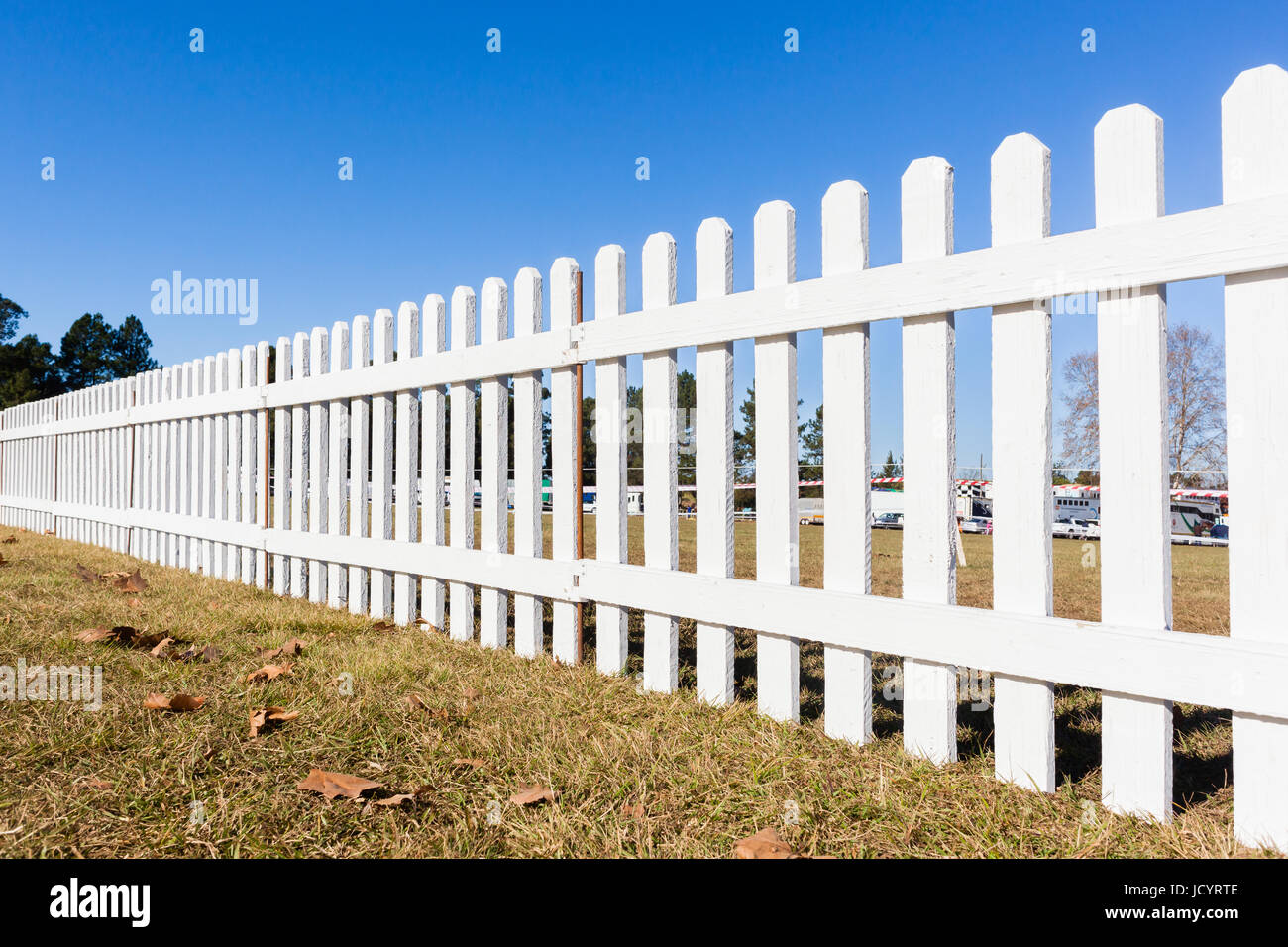 Fence boundary three feet wood structure across field landscape Stock ...