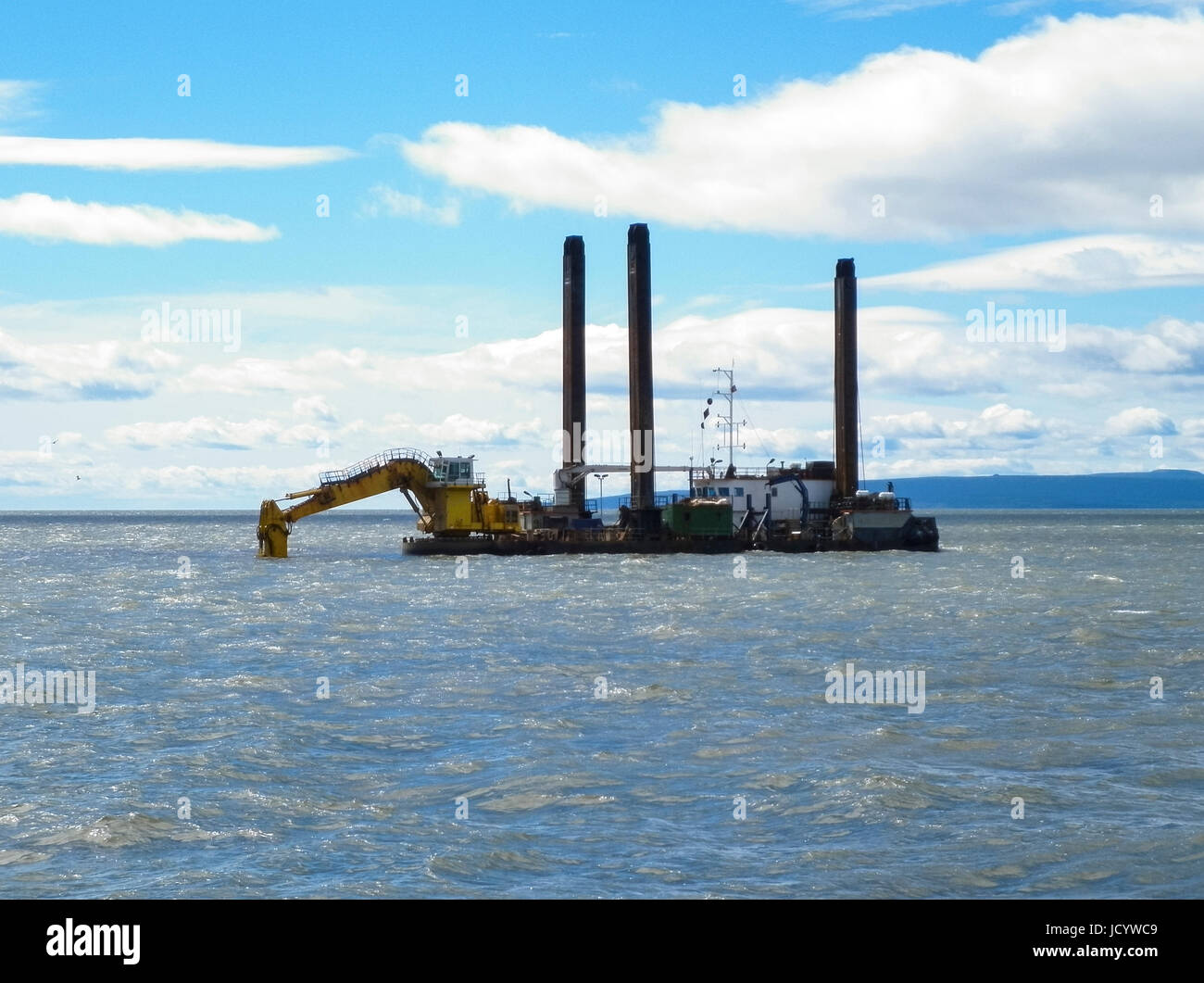 Barge with excavator. Excavator on the barge. Special vessel with a ...